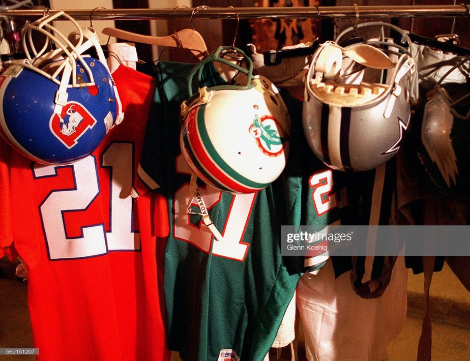 A selection of NFL jerseys and helmets that Deion Sanders wore during ...